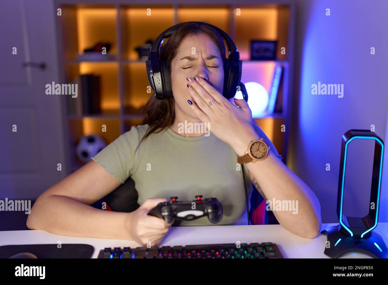 Tired female gamer playing video games hi-res stock photography and ...