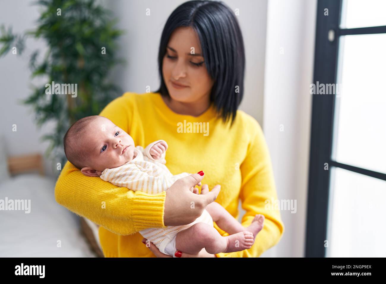 Mother and son smiling confident standing at home Stock Photo - Alamy