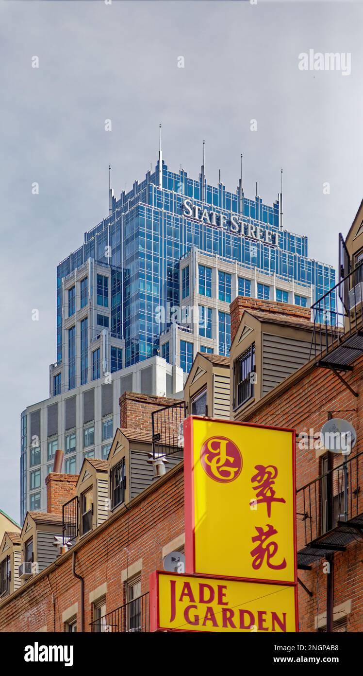 State Street Financial Center is a grey and blue tower capped in blue ...