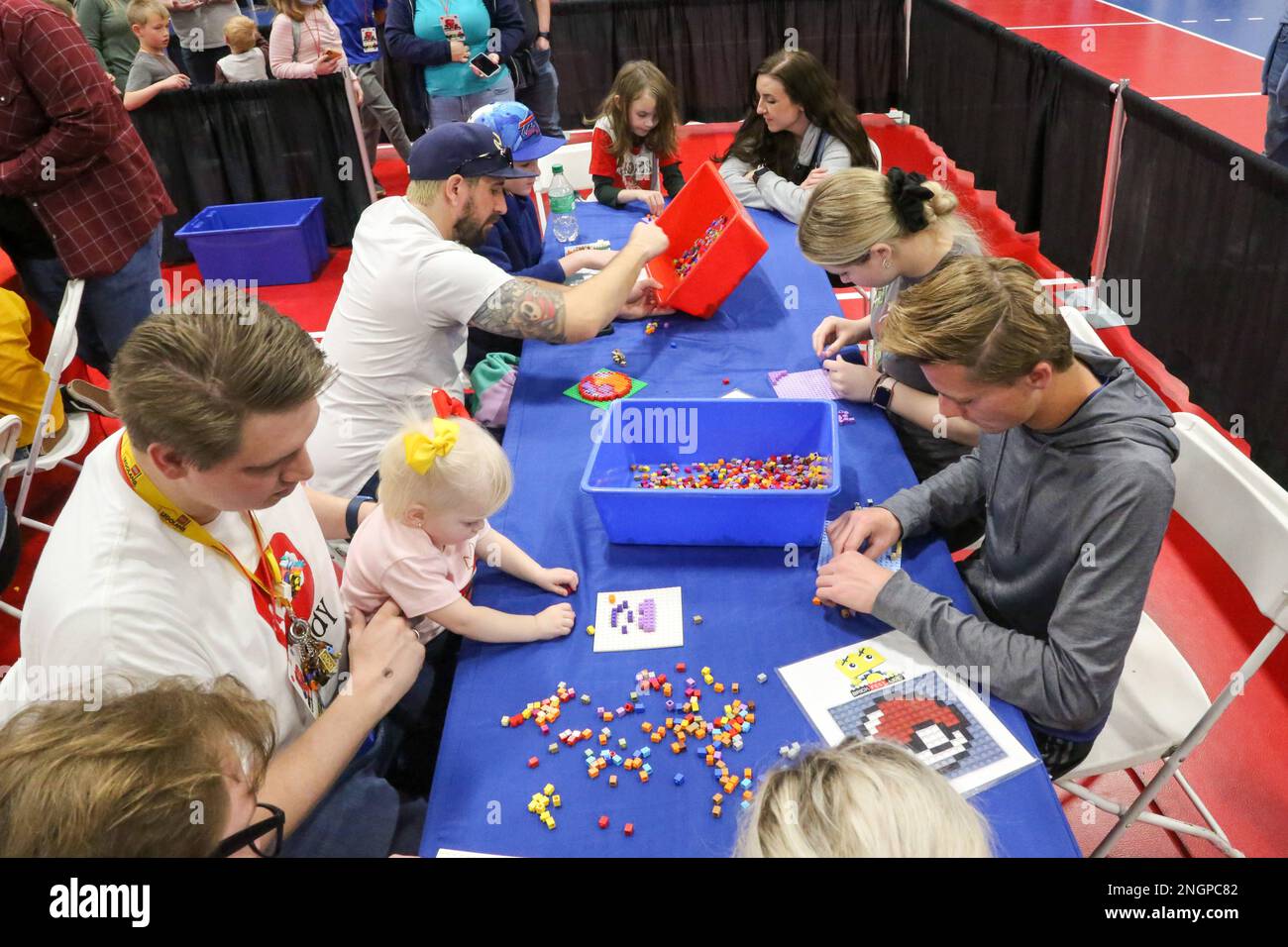 Families work together building LEGO boards with mini LEGO blocks ...