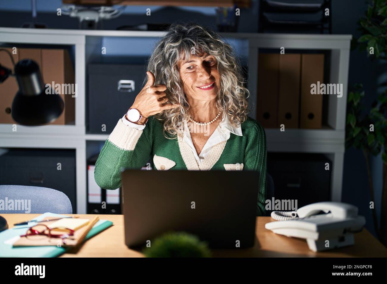 Senior woman phone call night hi-res stock photography and images - Alamy