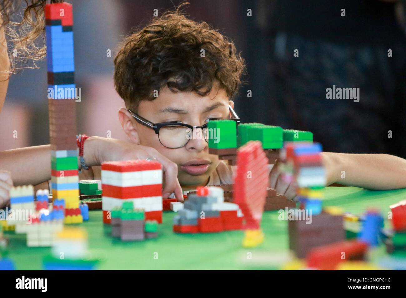 A young boy assembles his own LEGO creation at Brick Fest Live at Bell ...