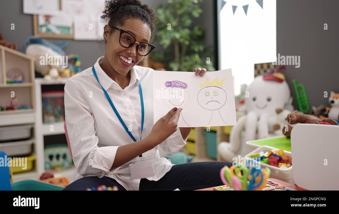 African american woman teacher having emotion therapy at kindergarten ...