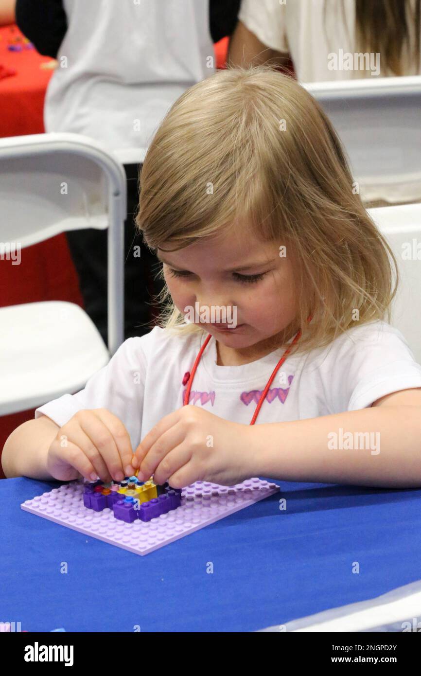 Families work together building LEGO boards with mini LEGO blocks ...