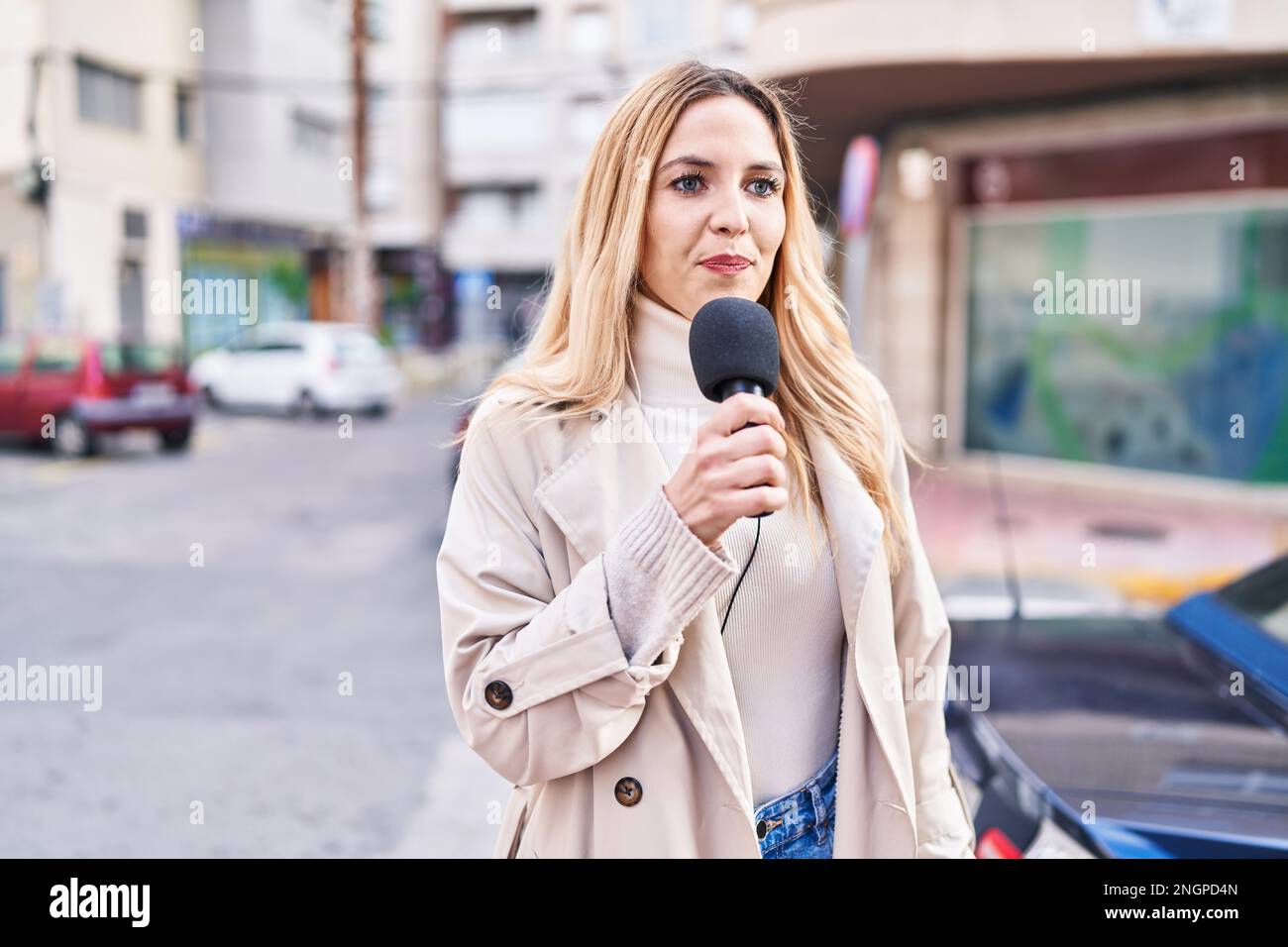 Young blonde woman reporter working hi-res stock photography and images ...