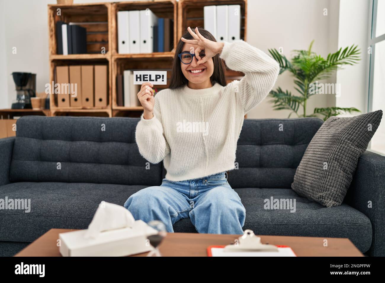 Young hispanic woman going to therapy at consultation office asking for ...