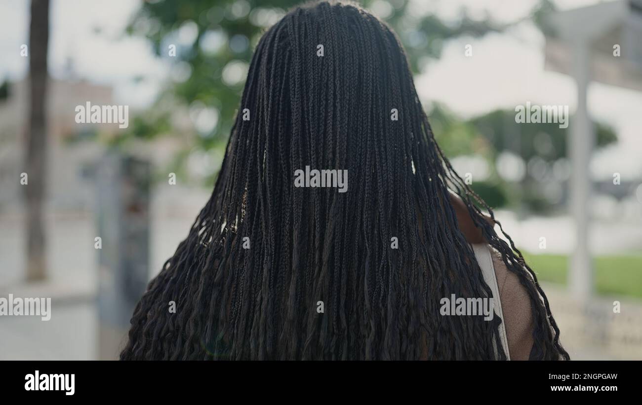African woman standing backwards at park Stock Photo - Alamy