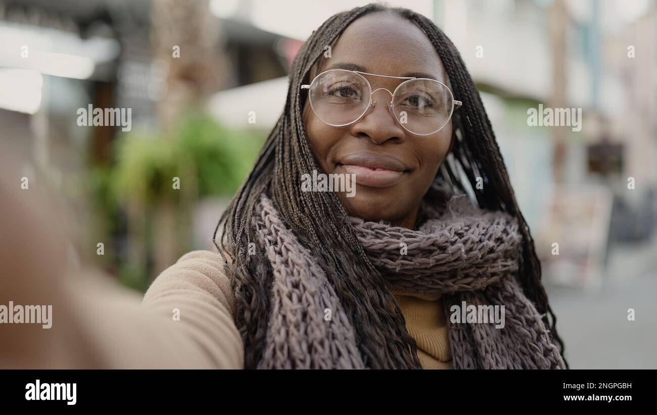 African woman taking selfie smiling at street Stock Photo - Alamy