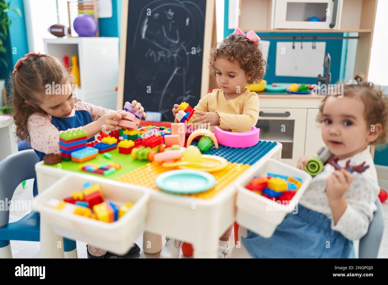 Group kids playing construction blocks hi-res stock photography and ...