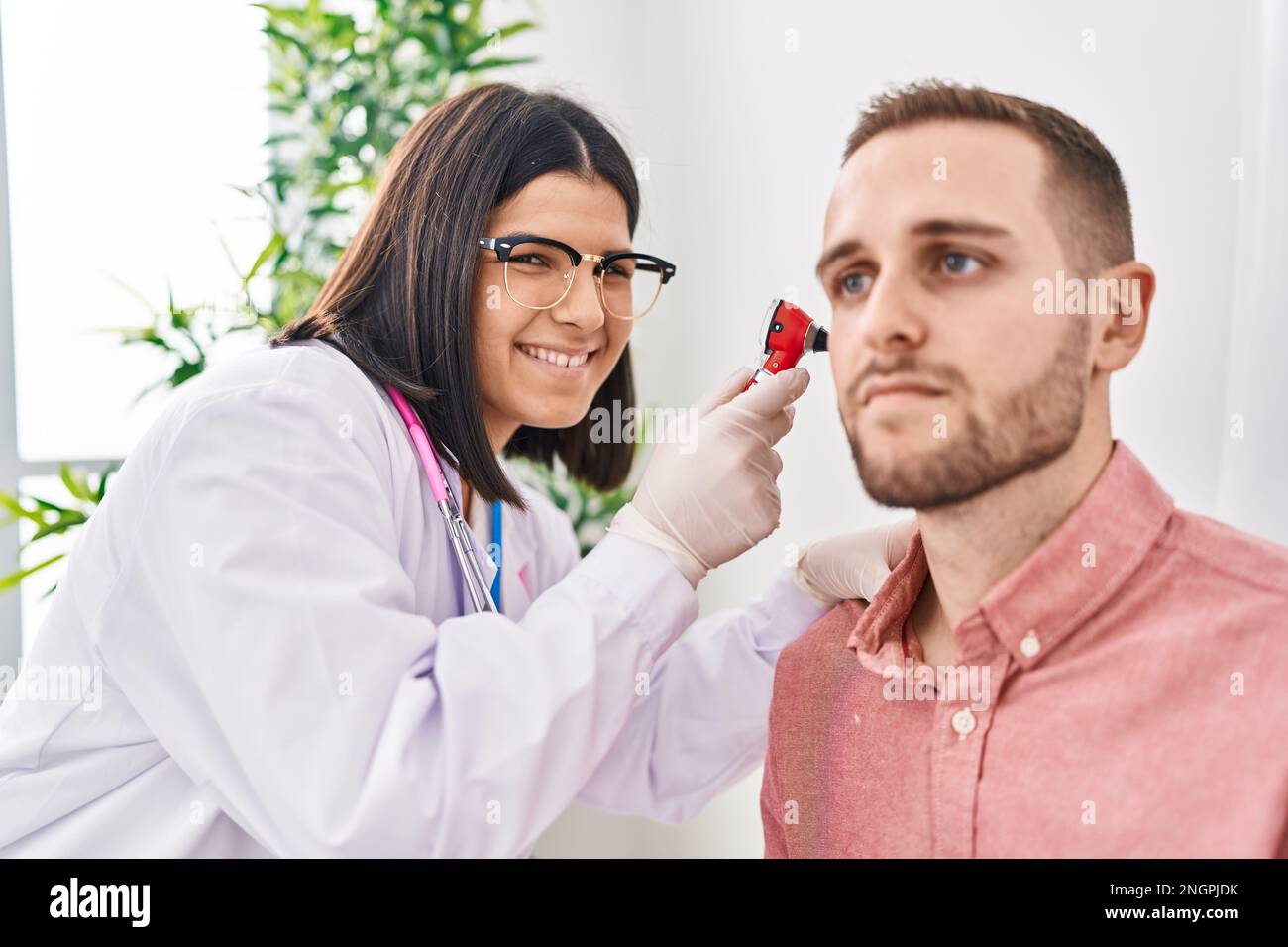 Man and woman doctor and patient having medical consultation examining ...