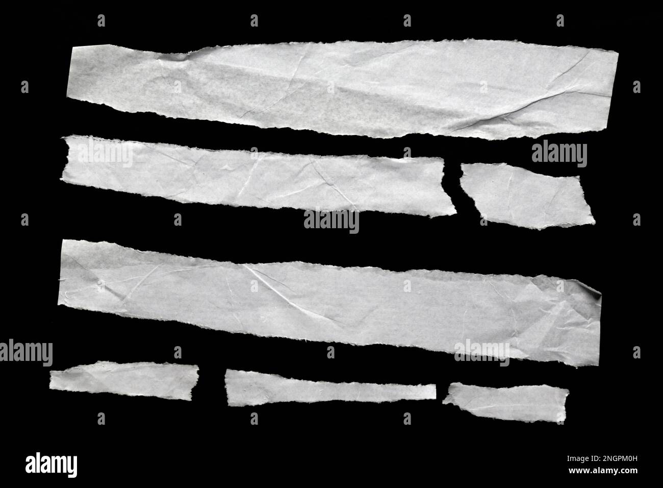 Set of pieces of crumpled paper stripes isolated on black, design ...