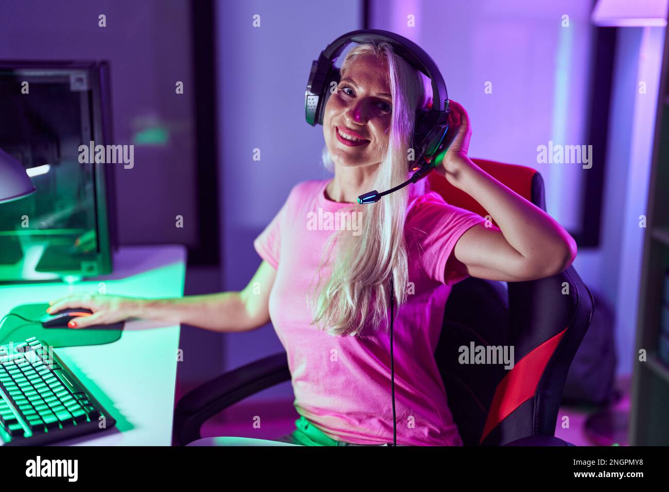 Young blonde woman streamer smiling confident using computer at gaming ...
