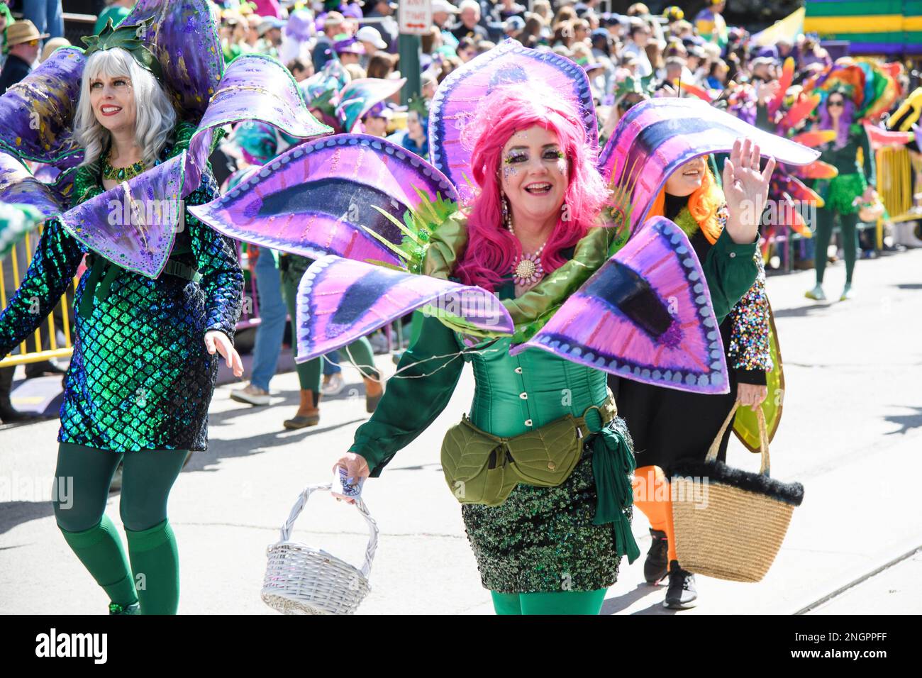 Parade goers are seen at the Krewe Of Iris parade on Saturday, Feb 18 ...