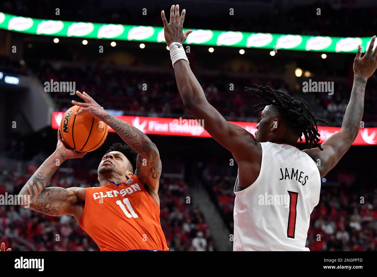 Clemson guard Brevin Galloway (11) takes a shot at the basket away from ...