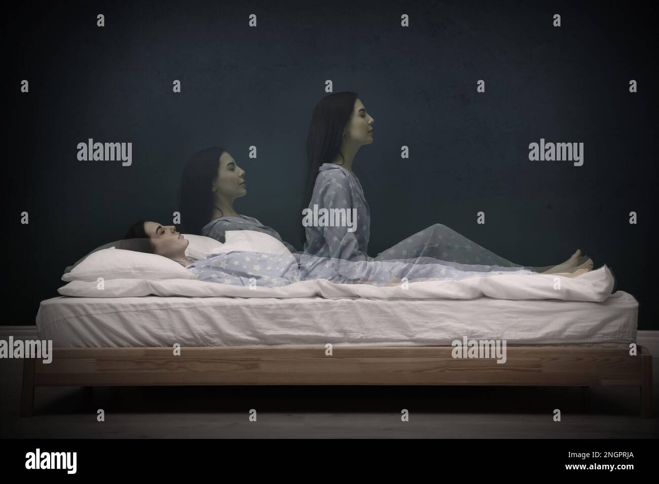 Somnambulist rising from bed near dark wall indoors, multiple exposure ...