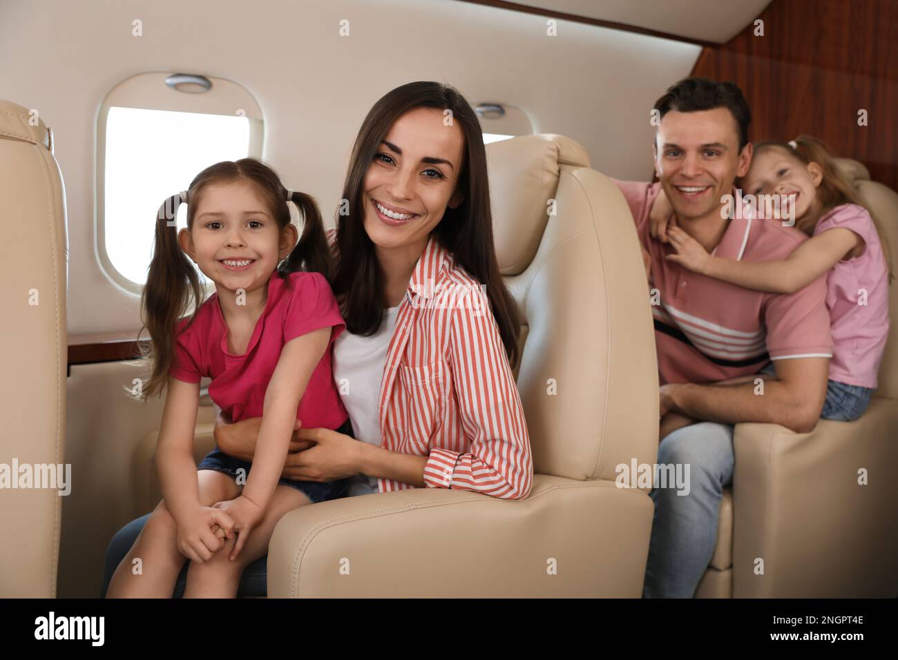 Happy family together in airplane during flight Stock Photo - Alamy