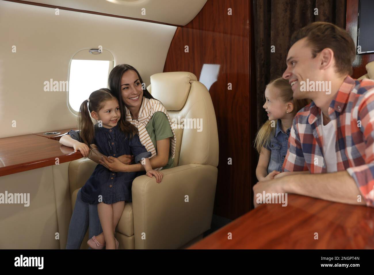 Happy family together in airplane during flight Stock Photo - Alamy