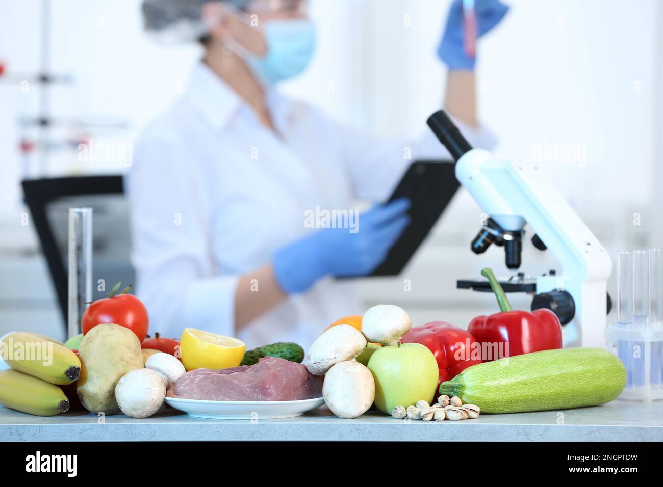 Fresh vegetables, fruits and meat on table in laboratory. Food quality ...