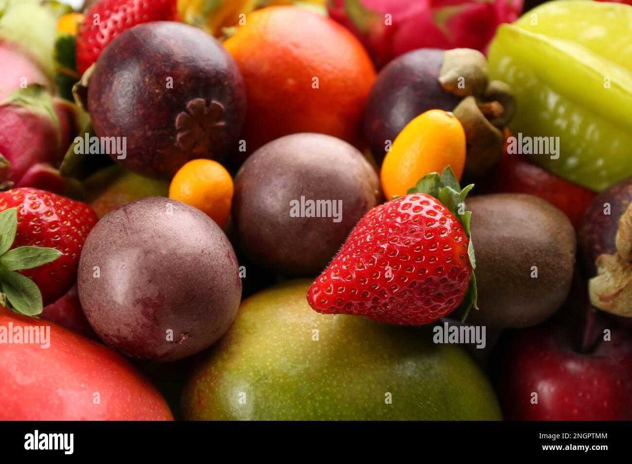 Assortment of fresh exotic fruits as background, closeup Stock Photo ...