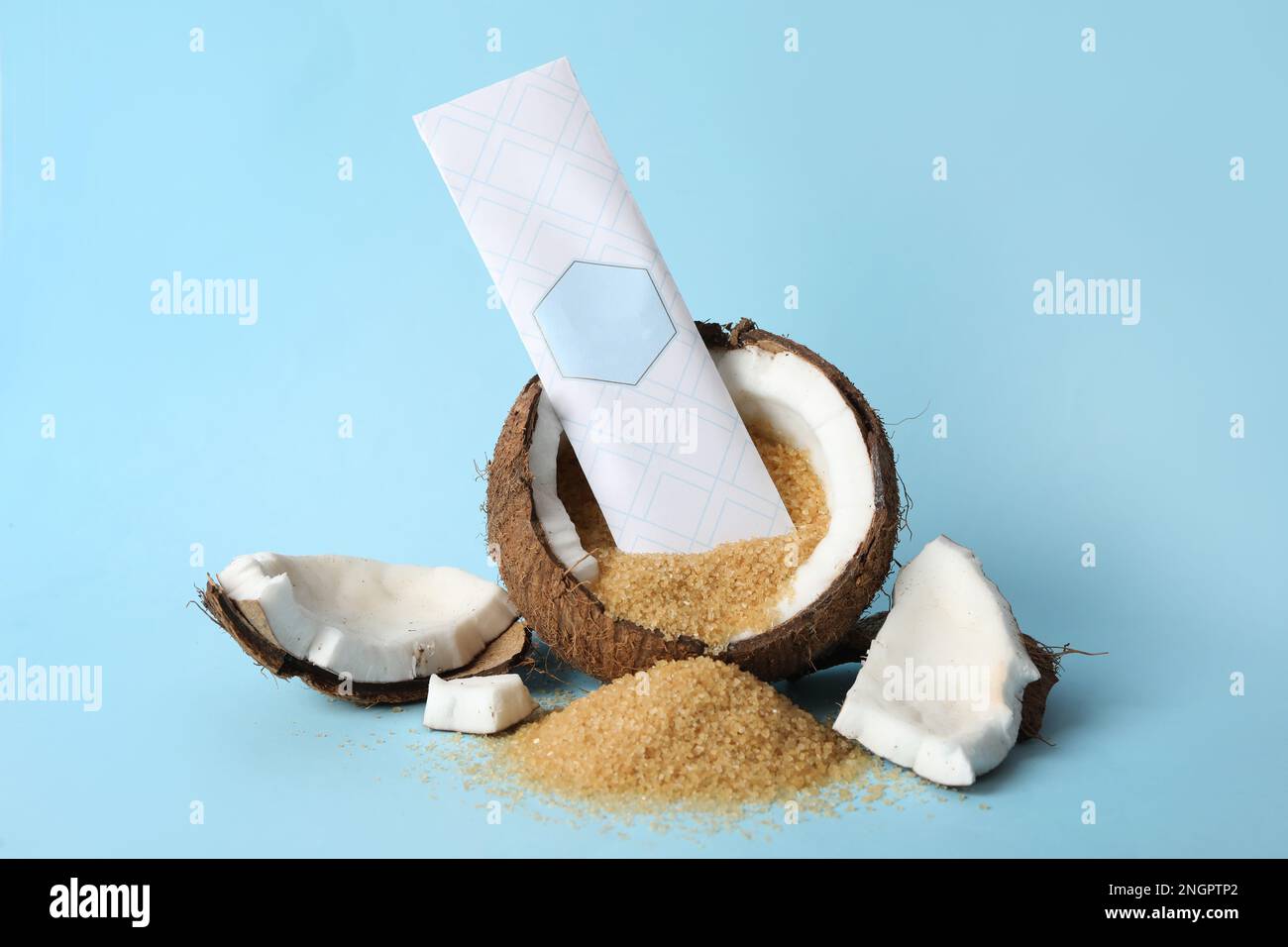 Scented sachet, coconut and brown sugar on light blue background Stock ...