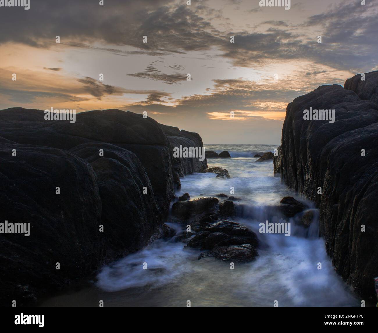 beautiful sunset between the rock,long exposure gave nice dramatic ...