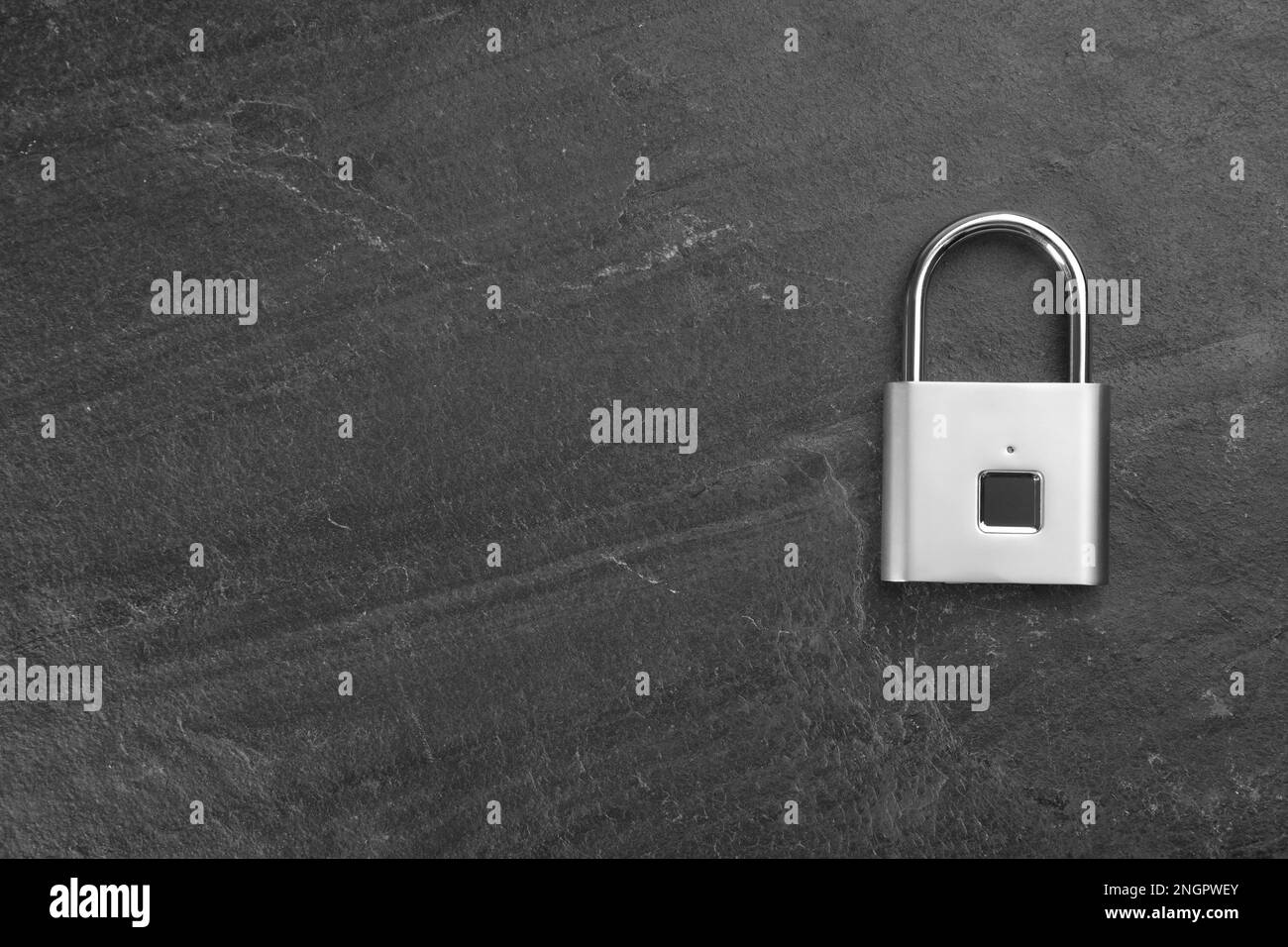 Modern padlock on black table, top view. Space for text Stock Photo - Alamy