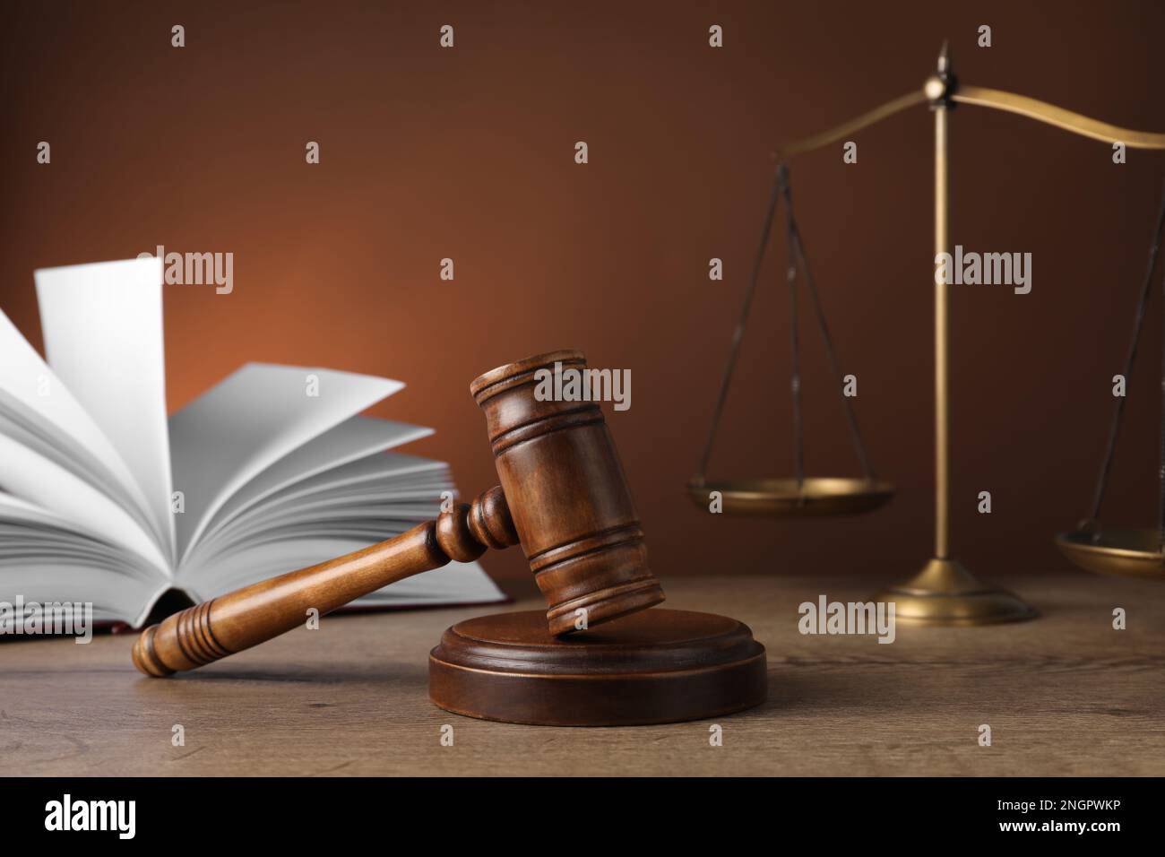 Wooden gavel, scales and book on table. Law concept Stock Photo - Alamy