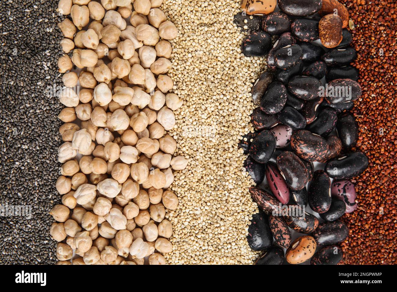 Various raw veggie seeds as background, top view Stock Photo - Alamy