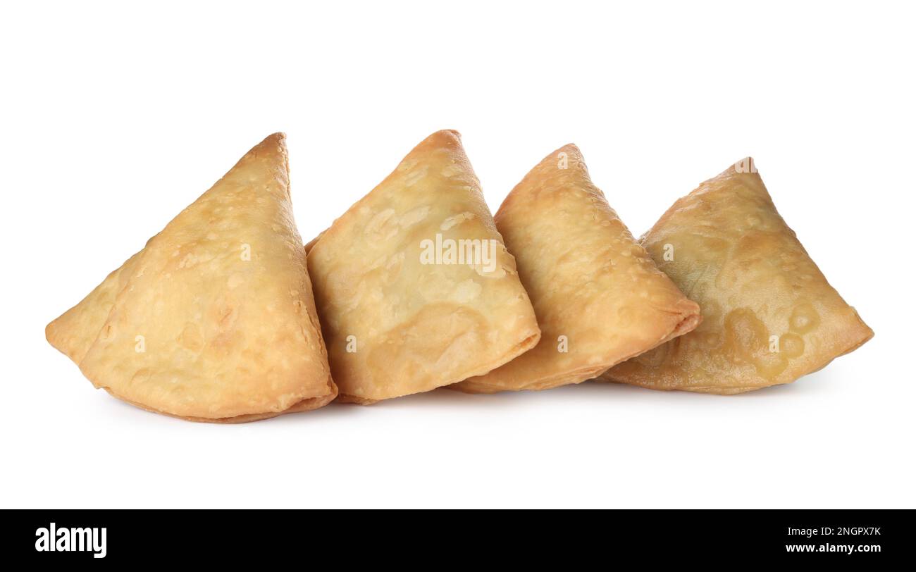 Fresh delicious crispy samosas on white background Stock Photo - Alamy