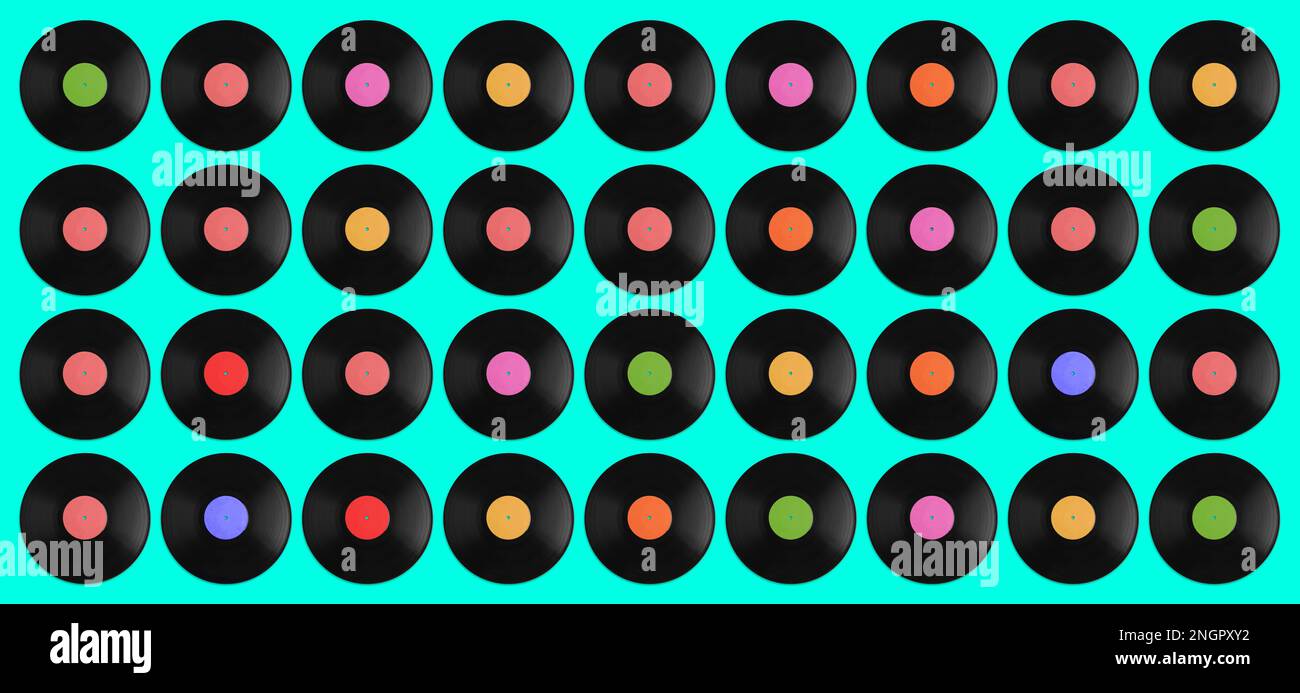 Set with vintage vinyl records on turquoise background, top view ...