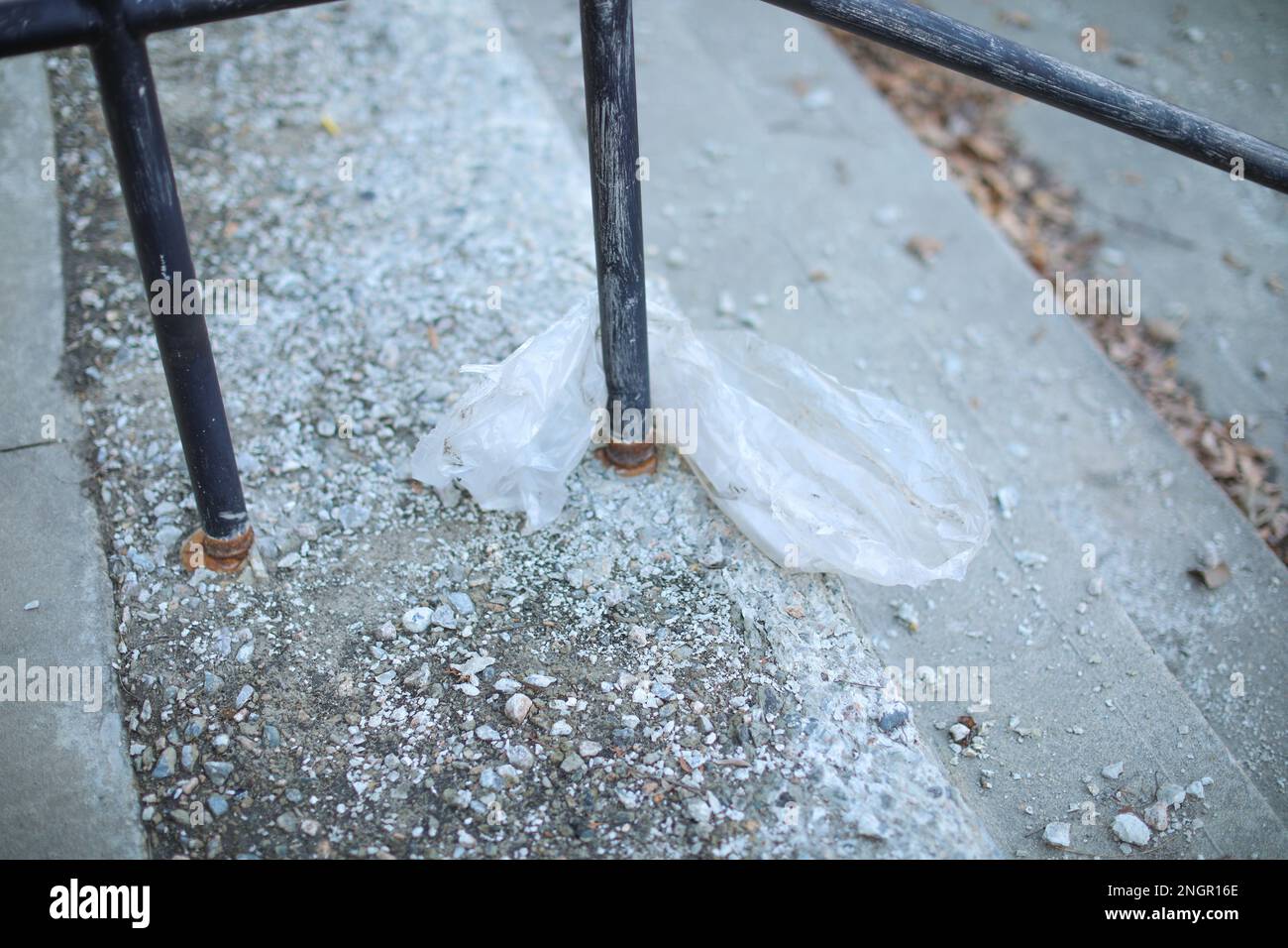 Trash on the street showing environmental issue Stock Photo - Alamy