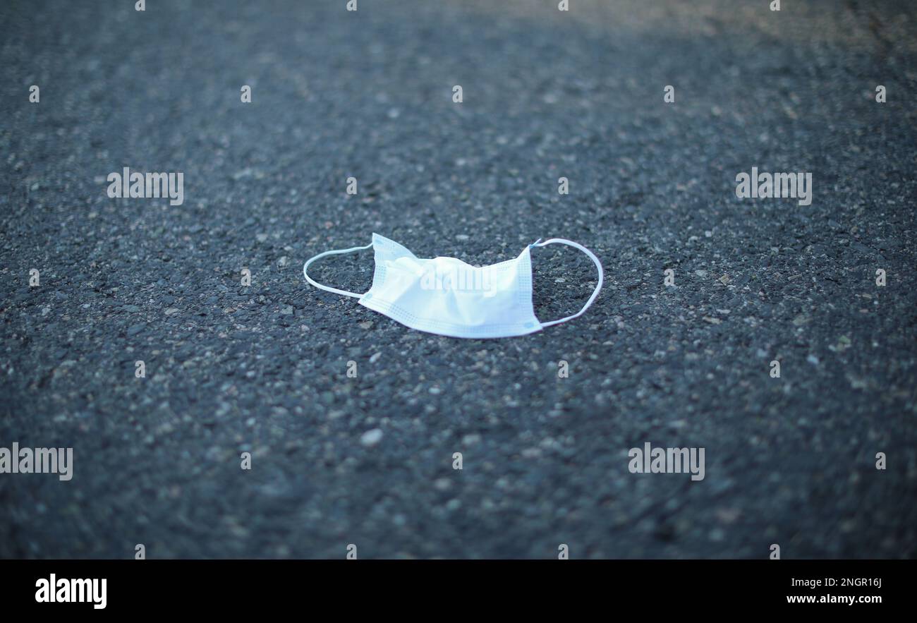 Trash on the street showing environmental issue Stock Photo - Alamy