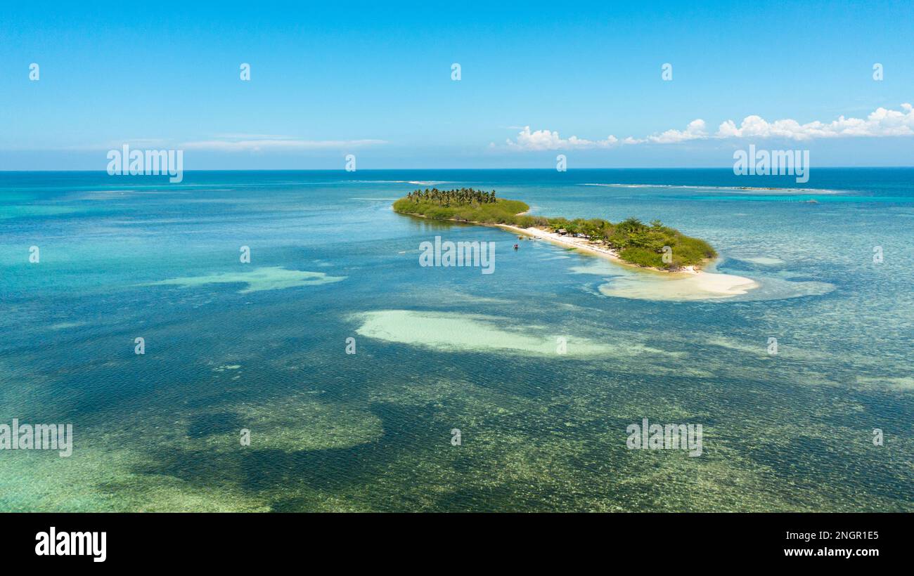 Island with a sandy beach and azure water. Tanduyong Island ...
