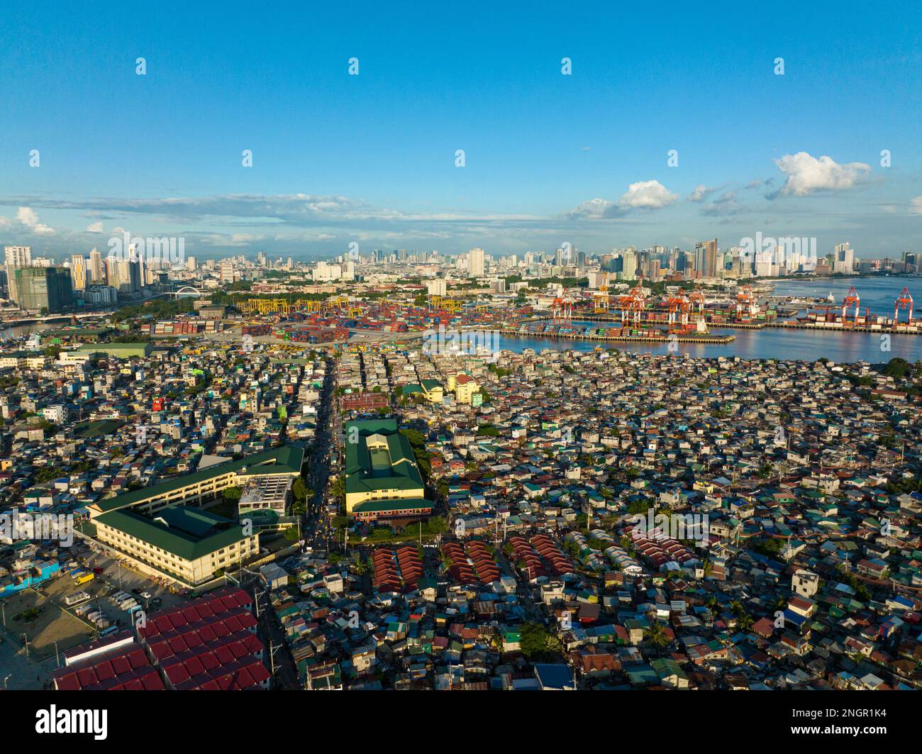 Aerial view of cityscape of Makati with sea port, the business center ...
