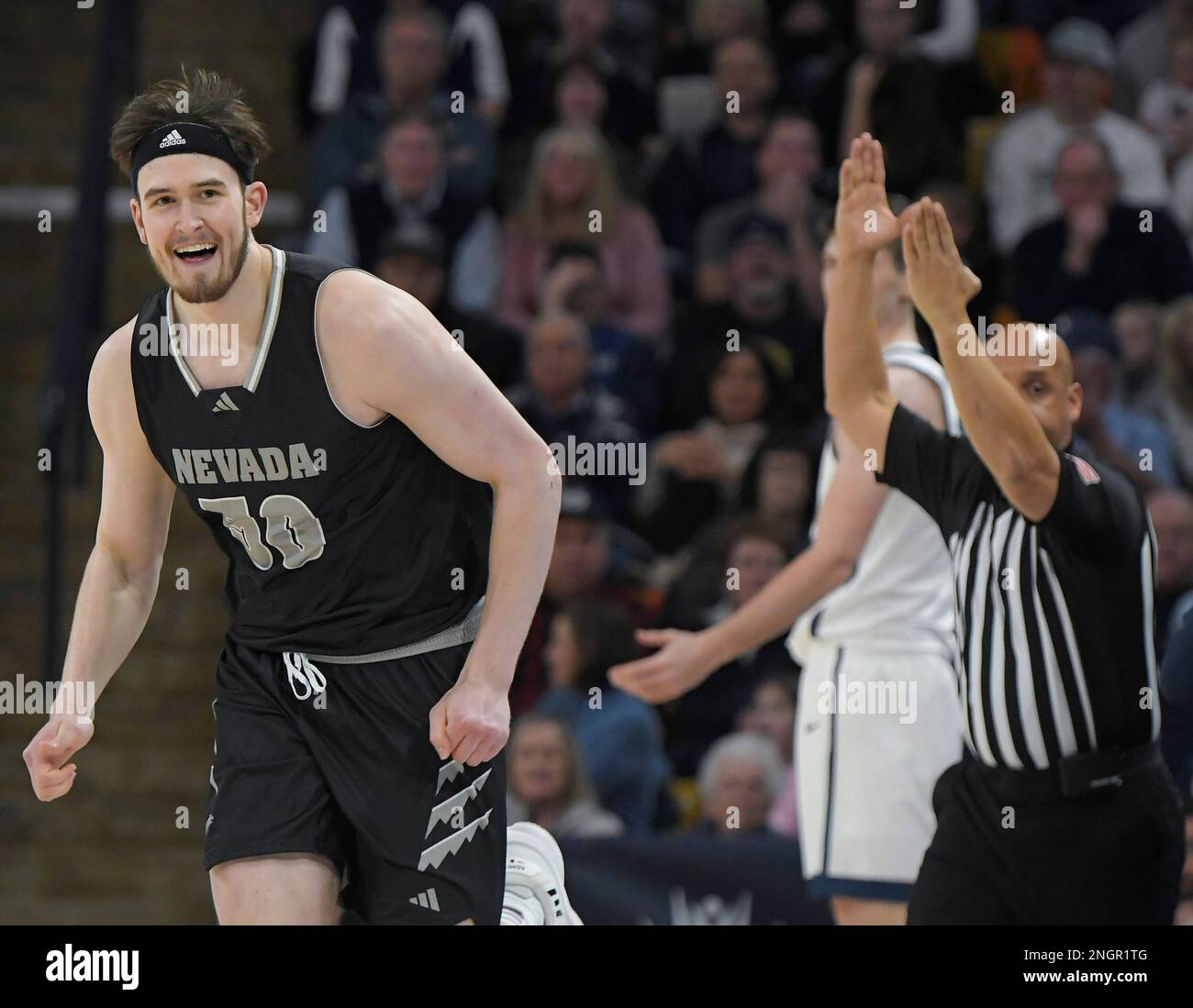 Nevada center Will Baker (50) celebrates after making a 3-point basket ...
