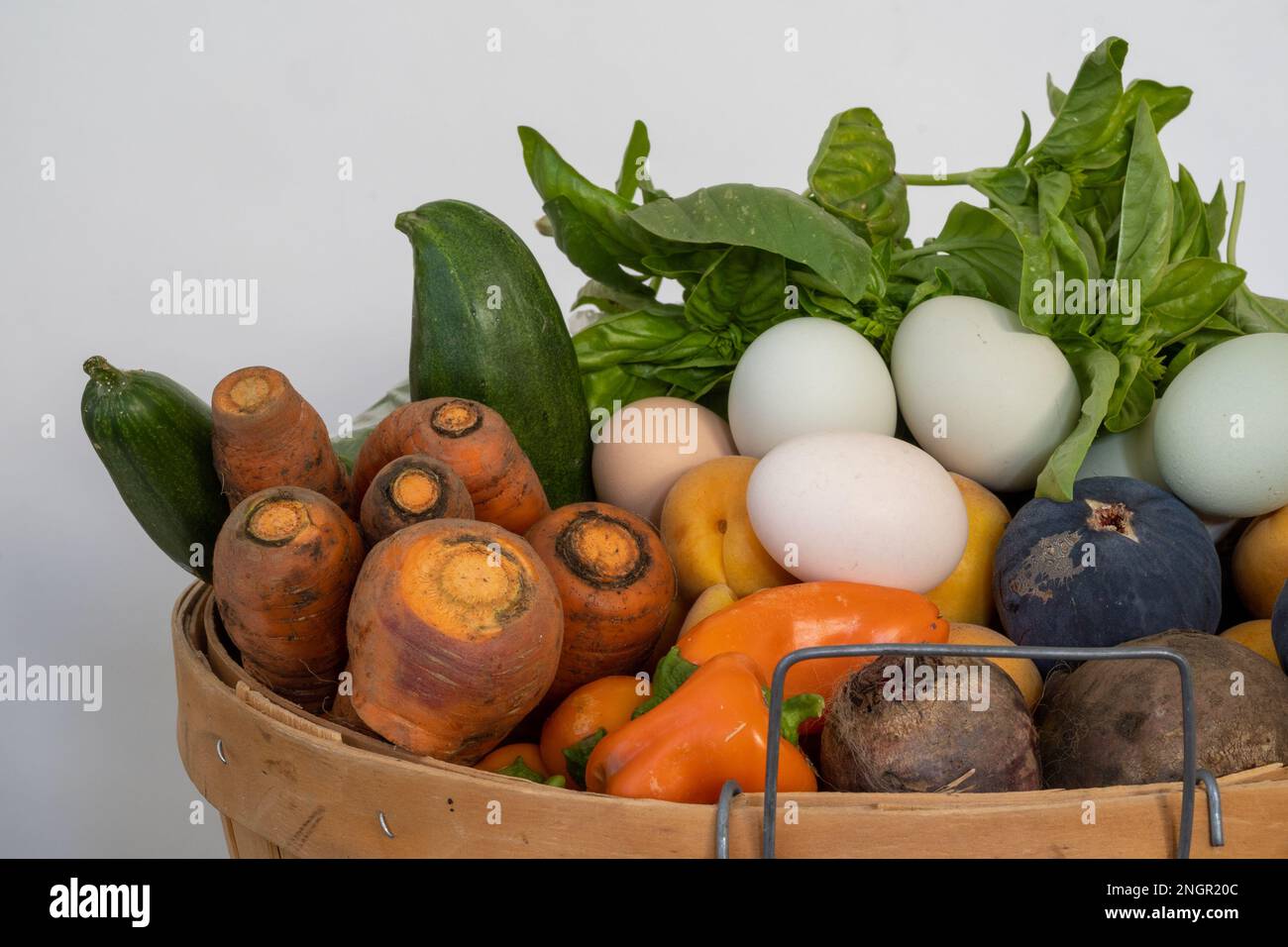 Close-up on organic vegetables in bamboo basket full of fresh ...