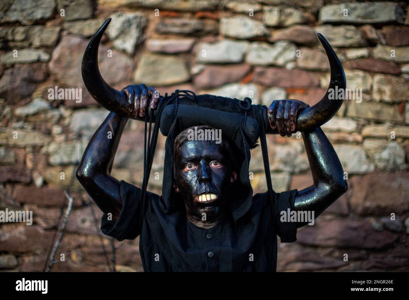 Luzon, Spain. 18th Feb, 2023. A man dressed as "Devil of Luzon" poses ...