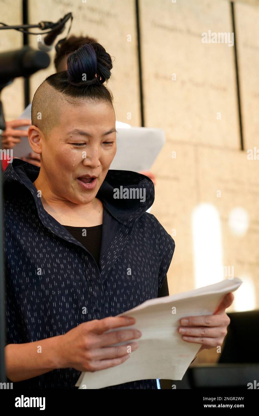 Artist Traci Kato-Kiriyama reads aloud a dedication to late the Jim ...