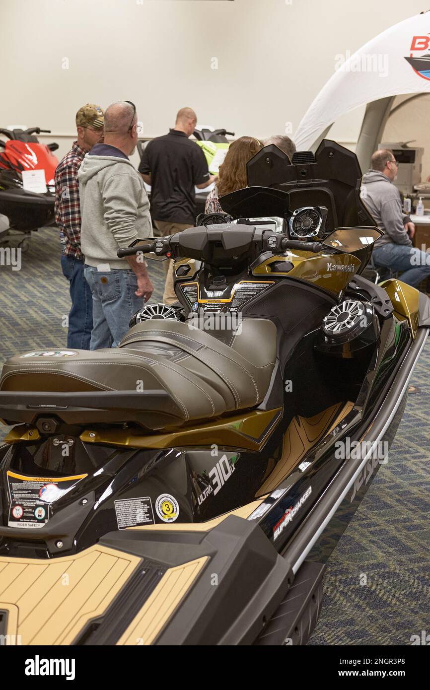 Visitors look at jet ski watercraft models on display at the Seaside ...
