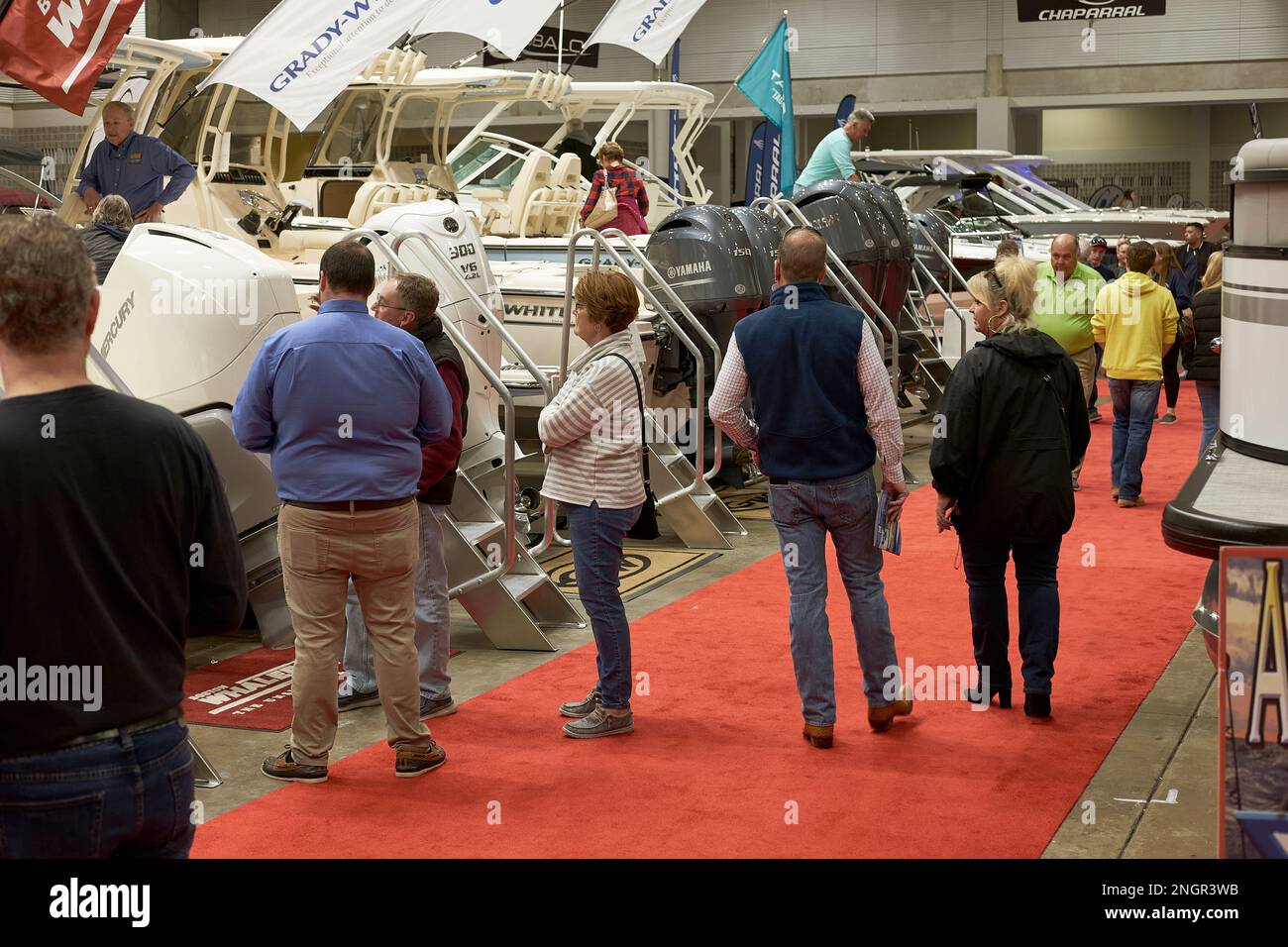 Spectators view the latest motorboats at the 2023 Seaside Boat Show in ...