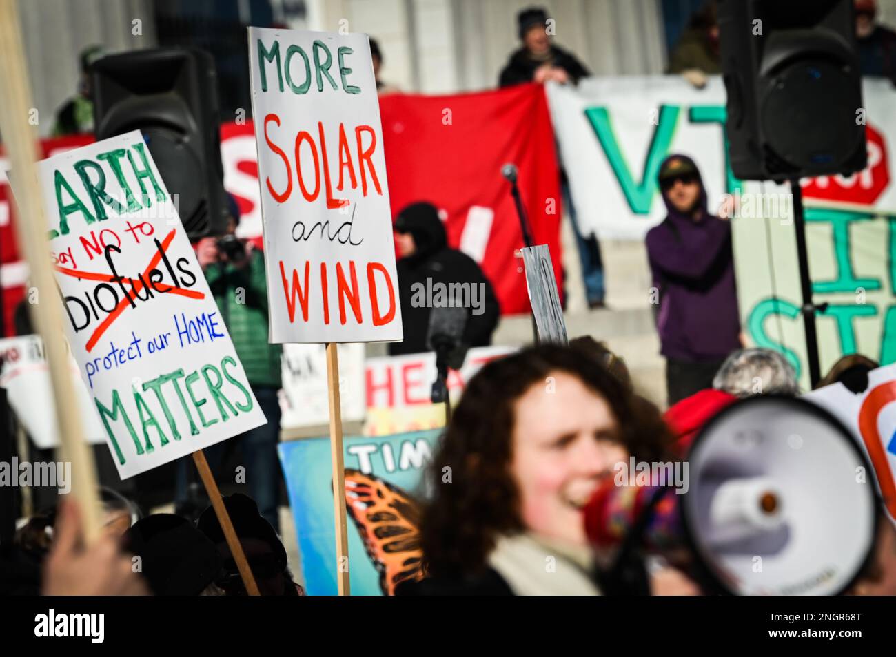 Signs call for more renewable power at a march calling for action to ...