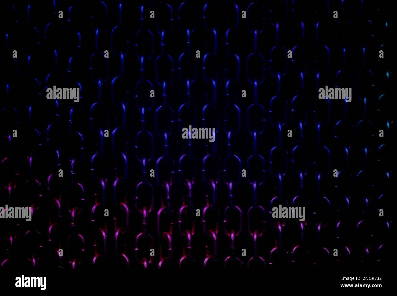 Rusty chains isolated on black background in neon backlighting ...