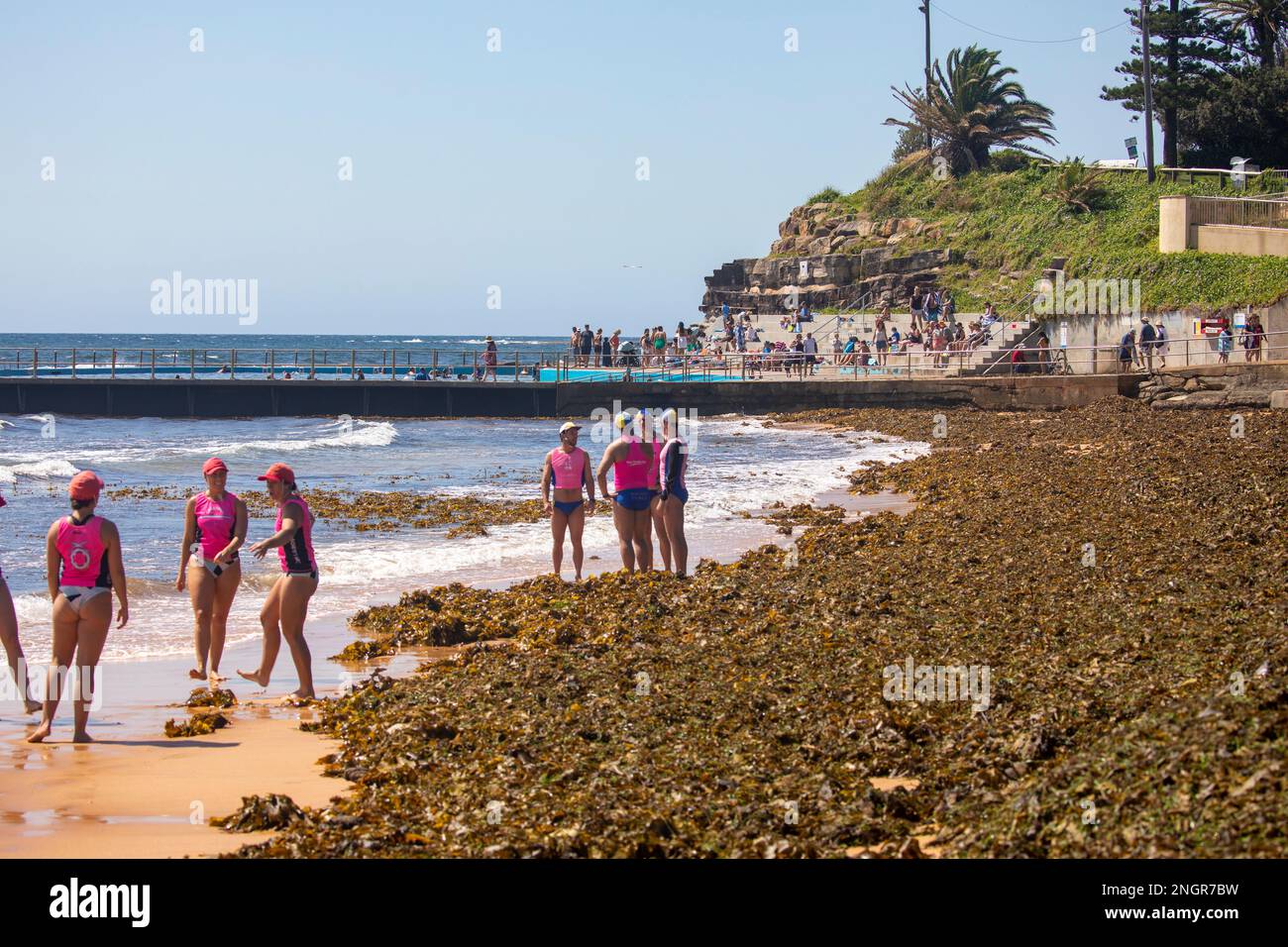 Traditional surfboat crew and rowers stood oon Collaroy beach Sydney ...