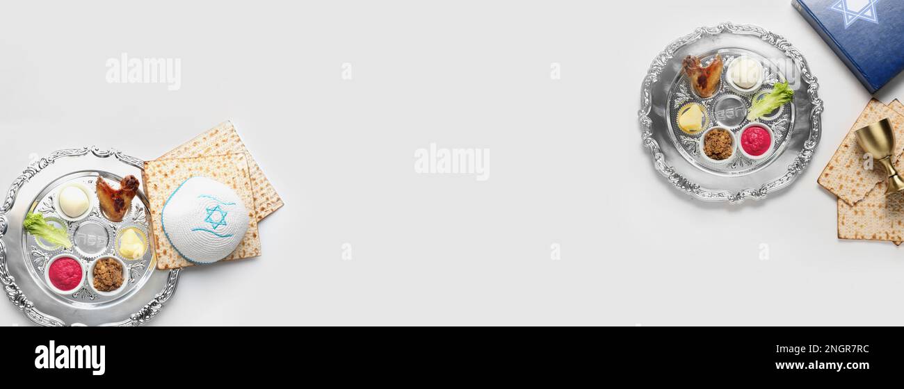 Banner with Passover Seder plates, flatbread matza and Torah on white ...