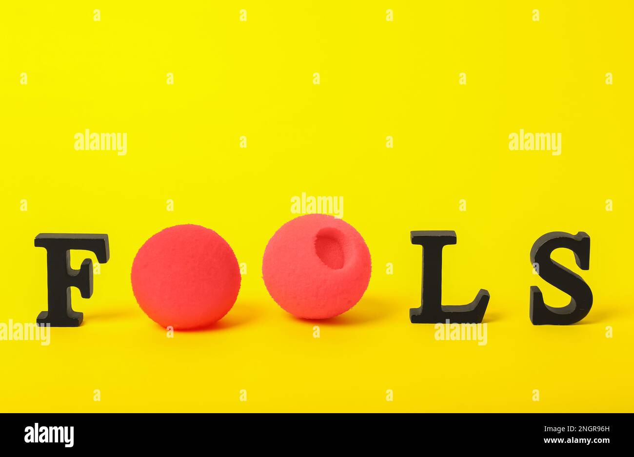 Word FOOL'S made of letters and clown noses on yellow background Stock ...