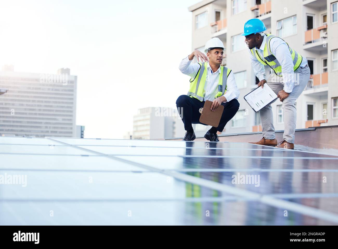Solar energy, sustainability and engineer team on a rooftop to repair ...