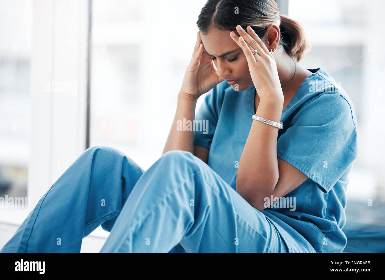 Burnout, stress and medical with nurse on floor of hospital for sad ...