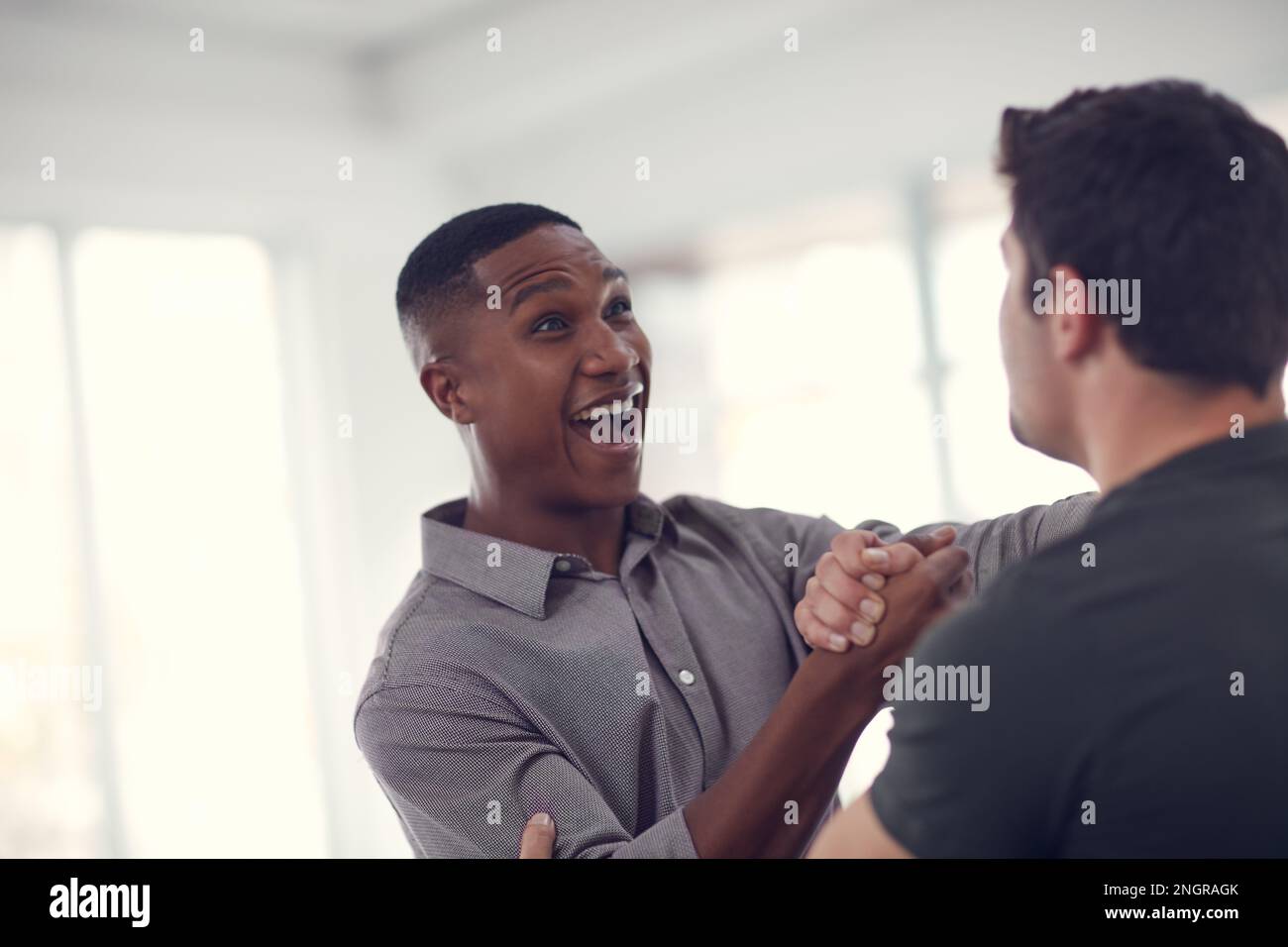 Two hands gripping hi-res stock photography and images - Alamy