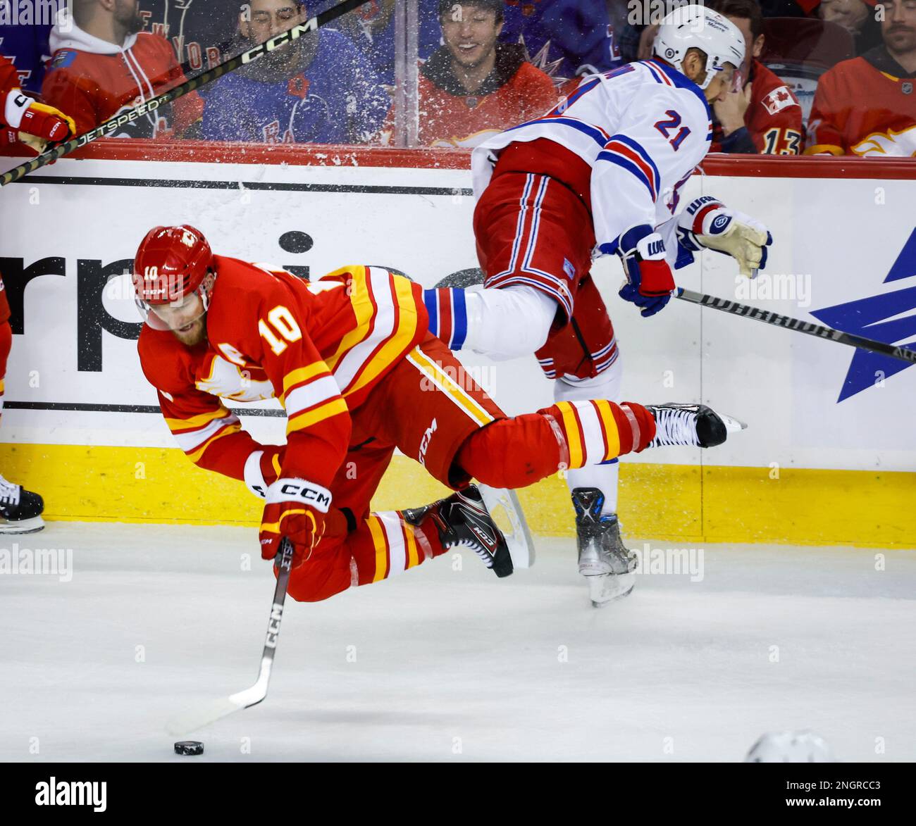 New York Rangers forward Barclay Goodrow, right, checks Calgary Flames ...