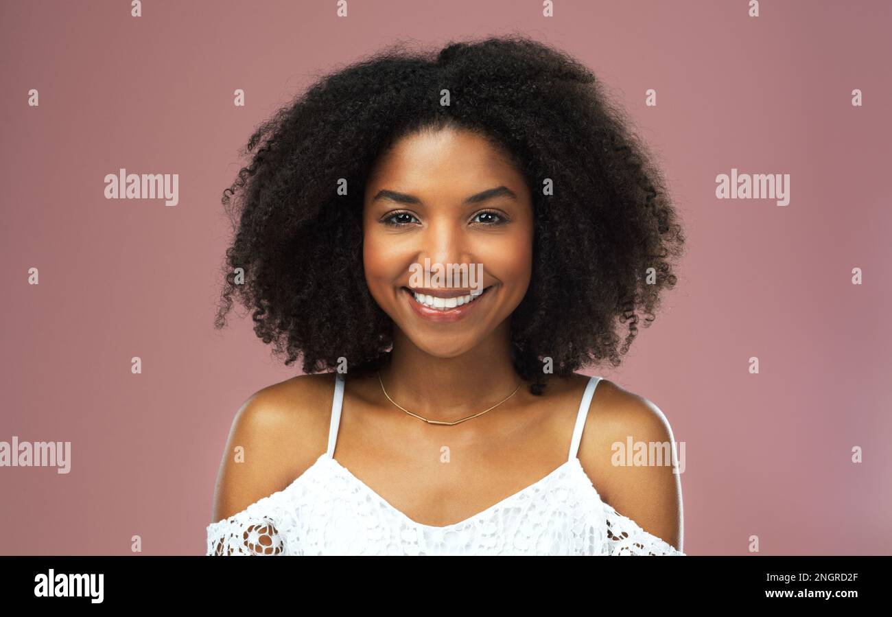 Her smile is what makes her unique. a beautiful young woman smiling ...